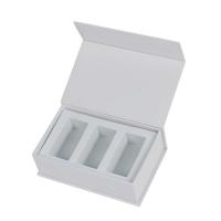 China Luxury White Magnetic Rigid Cardboard Cosmetic Bottle Essential Oil Packaging Boxes with Foam Insert for sale