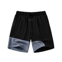 China Men's loose quick drying casual solid color patchwork beach pants for sale