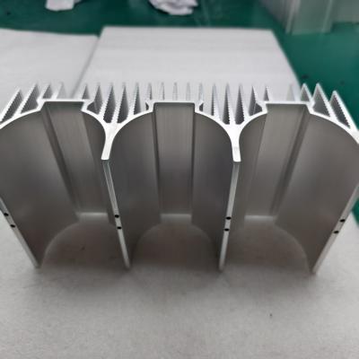 China Triple Arc Cavity Serrated Dense Fin Extruded Aluminum Heat Sink 6063 for Inverter Cooling for sale