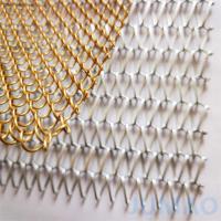 China Jumao Spiral Metal Mesh Curtains - 12m Length, 6-30mm Holes for Space Dividers & Architectural Applications for sale