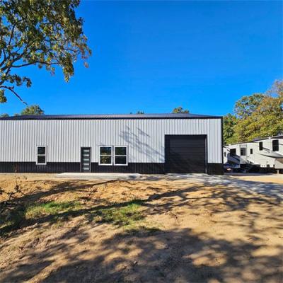 China Portal Frame Steel Structure Workshop With Rolled Up Door for sale
