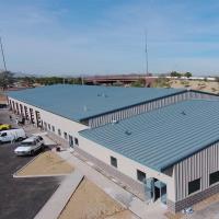 China Sloped Roof Prefabricated Steel Building Featuring Concrete Foundation and Floor Deck Concrete Engineered for Space Utilization for sale