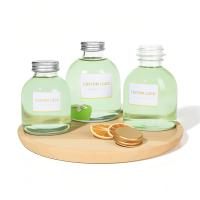 China Custom Round Beverage Glass Bottle With Screw Cap Screen Printing For Juice Tequila Whisky for sale