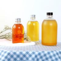 China Crystal Clear Glass Beverage Bottle With Screw Cap 150ml 250ml 350ml 500ml for sale