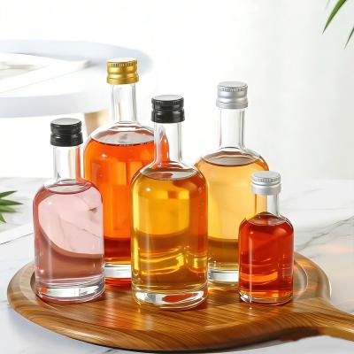 China Round Thick Bottom Extra Flint Clear Liquor Glass Bottle For Vodka Whiskey Gin for sale