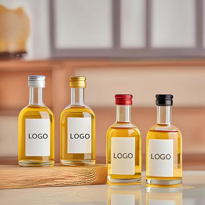 China 50ml Mini Liquor Glass Bottle With Screw Cap Custom Logo For Vodka Whiskey Wine for sale