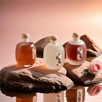 China Frosted Round Glass Bottle With Cork Stopper For Customizable Beverage Packaging for sale