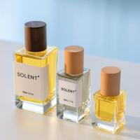 China Food Safe Refillable Perfume Glass Bottle With Wooden Cap Empty Cosmetic Container for sale