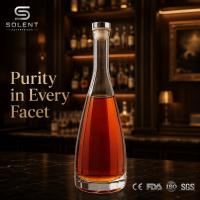 China Faceted Heavy Base Conical Glass Liquor Bottle With Leakproof Cork Sealing For Spirits for sale