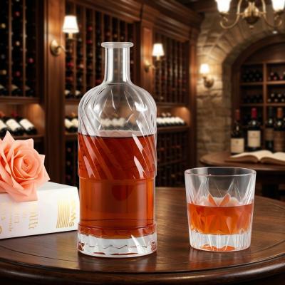 China Solent Luxury Spiral Diamond Cut High Flint Glass Liquor Bottle With 3D Relief Patterns For Spirits for sale