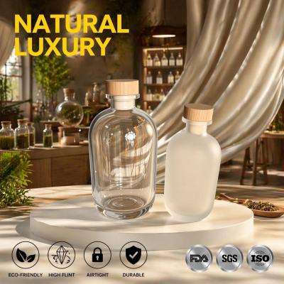 China Solent Luxury Round Frosted Clear Glass Bottle With Wooden Cork Stopper High Flint Material For Wine Liquor for sale