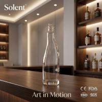 China Asymmetric Curved Neck 480ml Glass Liquor Bottle With Leakproof Sealing Solution For Spirits for sale