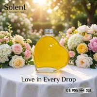 China Heart Shaped Leakproof Glass Bottle With Screw Cap High Clarity Lead Free Glass For Customizable Beverage Containers for sale