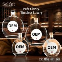 China Round Flat Liquor Lead Free Glass Bottle With Leakproof Cork Finish High Transparency For Whiskey Vodka for sale