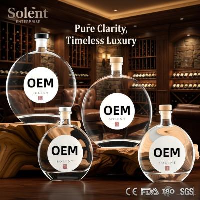 China Round Flat Liquor Lead Free Glass Bottle With Leakproof Cork Finish High Transparency For Whiskey Vodka for sale
