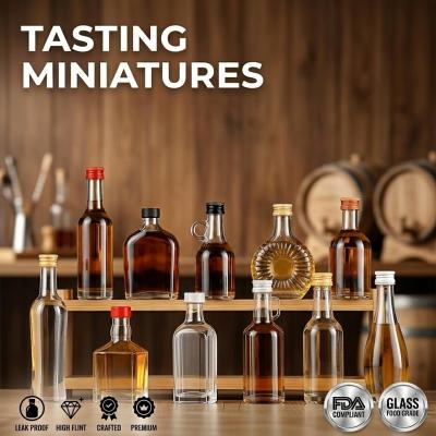 China Lead Free Mini High Flint Glass Liquor Bottle 50ml 100ml With Airtight Screw Cap for sale