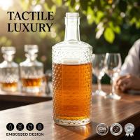 China 750ml Embossed Dimple Texture Glass Liquor Bottle With Screw Cap Sealing For Spirits for sale