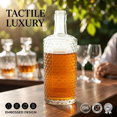 China 750ml Embossed Dimple Texture Glass Liquor Bottle With Screw Cap Sealing For Spirits for sale