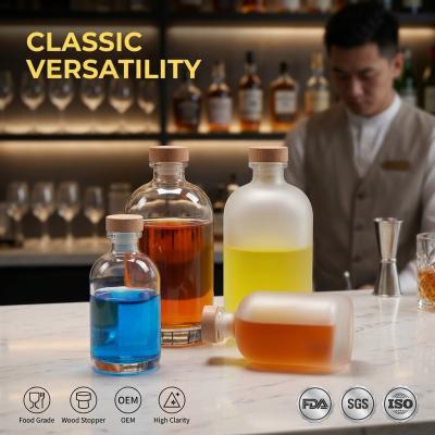 China Clear Frosted Glass Spirit Bottle With Wooden Cork Stopper Boston Round Design For Beverages for sale
