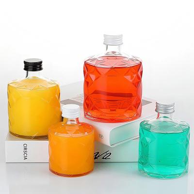 China Faceted Geometric Glass Bottle With Screw Cap Beverage For Liquor Juice 50-500ml for sale