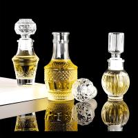 China Luxury Carved Glass Bottle For Spirits With Ornate Stopper Decorative Relief Whiskey Decanter for sale