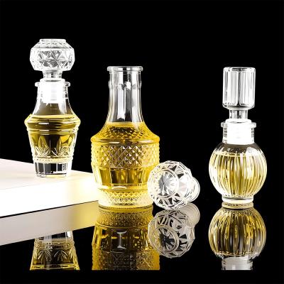 China Luxury Carved Glass Bottle For Spirits With Ornate Stopper Decorative Relief Whiskey Decanter for sale
