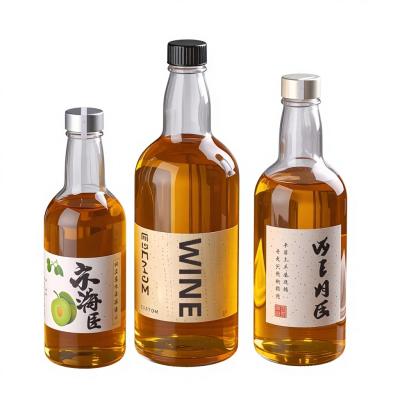 China Durable Cylindrical Liquor Glass Bottle With Screw Cap Custom Logo For Professional Beverage Bar for sale