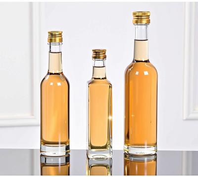 China Custom 50ml 100ml 150ml Liquor Glass Spirit Bottles With Aluminum Cap For Sample Use for sale