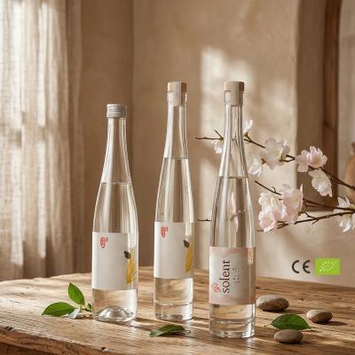 China Extra Flint Clear Slender Cylindrical Glass Bottle With Cork Screw Cap For Luxury Vodka Spirits for sale