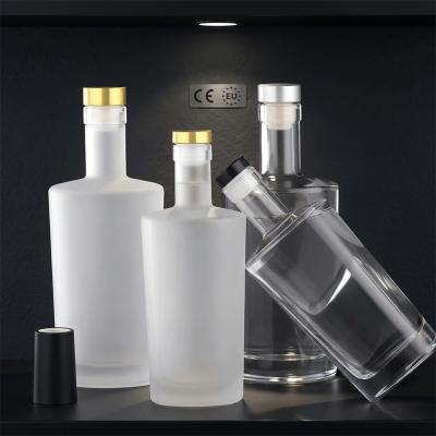 China Custom 750ml Frosted Clear Glass Bottle With Heavy Base T Top Stopper For Vodka Gin Whisky for sale