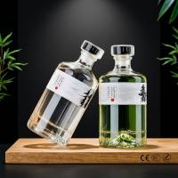 China Luxury 750ml High Flint Glass Spirit Bottle With 3D Mountain Base Cork Stopper for sale