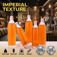 China Frosted Clear Glass Liquor Bottle With Heavy Base Round Shape For Spirits for sale