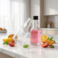 China 50ml Clear Round Mini Liquor Glass Bottle With Aluminum Screw Cap For Spirit Beverage Containers for sale