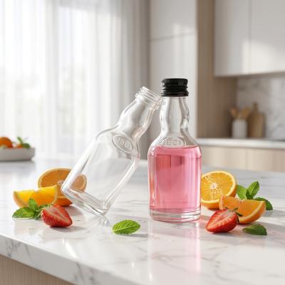 China 50ml Clear Round Mini Liquor Glass Bottle With Aluminum Screw Cap For Spirit Beverage Containers for sale