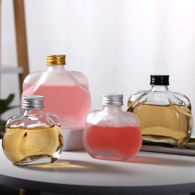 China 100ml 250ml Glass Bottle Cat Ear Leakproof Custom Logo For Beverage Liquor Packaging for sale