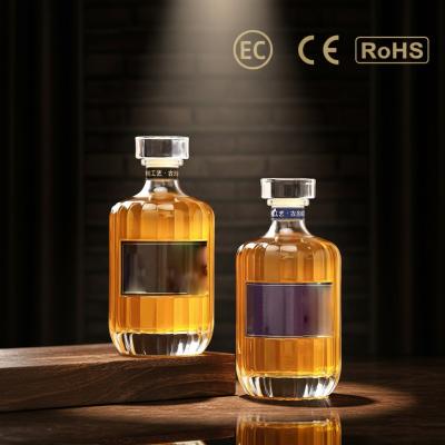 China Ribbed Vertical Striated Glass Liquor Decanters 500ml 700ml With T Shape Cork Cap For Whiskey Brandy for sale