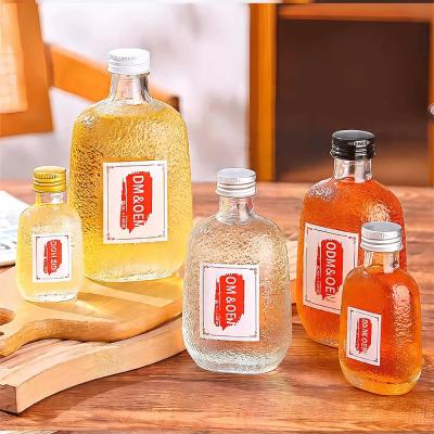 China Luxury Food Grade Transparent Glass Bottle With Airtight Metal Lid For Whiskey Vodka Gin Spirit Packaging for sale
