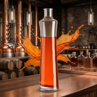 China Slanted Base Glass Liquor Bottle With High Flint Transparency Asymmetrical Molding For Spirits for sale