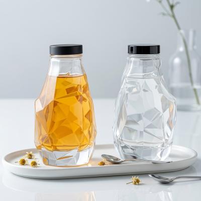 China 350ml Food Grade Water Glass Bottle Unique Geometric Design Glass Beverage Bottle for sale