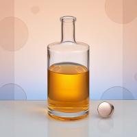 China Custom Super Flint Glass Liquor Bottle With Thick Bottom Round Shape For Spirits for sale