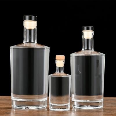 China Clear Glass Bottle 750ml 500ml 100ml With Cork Stopper For Vodka Gin Rum Tequila Whiskey for sale