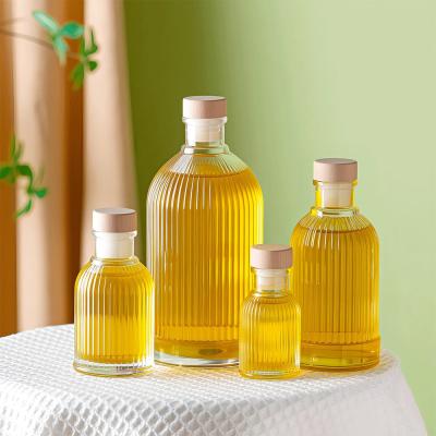 China Roman Column Vertical Stripe Glass Bottle With Cork Stopper Clear Body For Liquor Beverage for sale