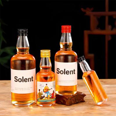 China Clear Finish Glass Bottle With Screw Cap Design For Liquor Spirits for sale