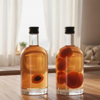 China Round Shape 500ml 750ml Liquor Glass Bottle With Screw Cap For Spirit Packaging for sale