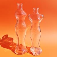 China Custom Sexy Body Shape Clear Glass Whiskey Bottle With Heavy Bottom For Spirits for sale