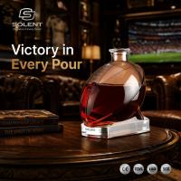 China Football Shaped 750ml Glass Bottle With Leakproof Sealing For Liquor Spirits for sale