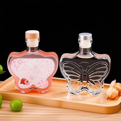 China Butterfly Shape Super Flint Glass Liquor Bottle With Cork Stopper For Whisky Brandy Vodka for sale
