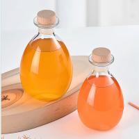 China Clear Frosted Glass Wine Bottle with Crown Cap Seal Custom Logo for Beverage Packaging for sale