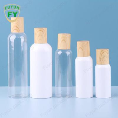 China Transparent PET 100ml Plastic Pump Bottles With Water Transfer Printing Wood Style for sale