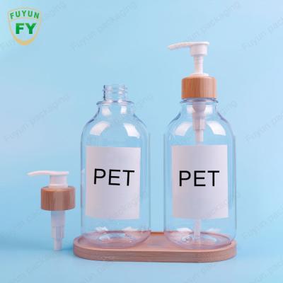 China Boston Shampoo Empty Plastic Pump Bottles Amber With Bamboo Lid for sale